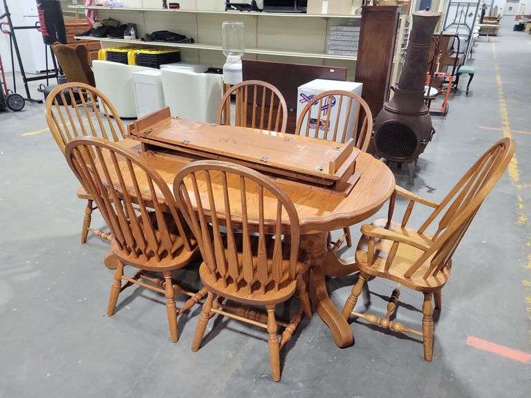 Oak Finish Dining Table W/ Chairs - Black And Gold Auctions