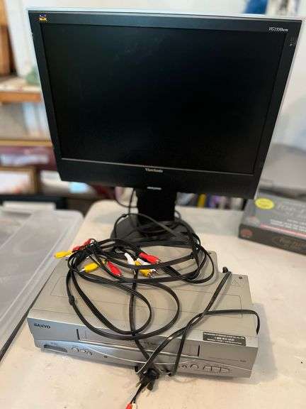 Monitor, VHS Player & Movies - Baker Auctions & Real Estate, LLC