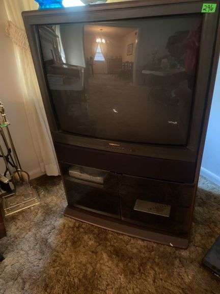 Magnavox tv, tv stand, & DVD player. - Baker Auctions & Real Estate, LLC