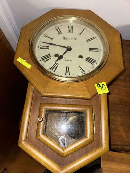 Montgomery Ward wall clock with key - Baker Auctions & Real Estate, LLC