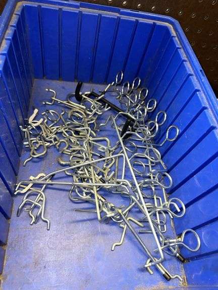 Blue tote and peg board hangers - Baker Auctions & Real Estate, LLC