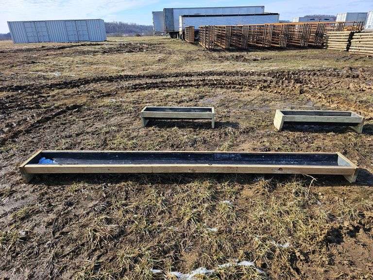 12ft Wood Frame Feed Trough - Baker Auctions & Real Estate, LLC