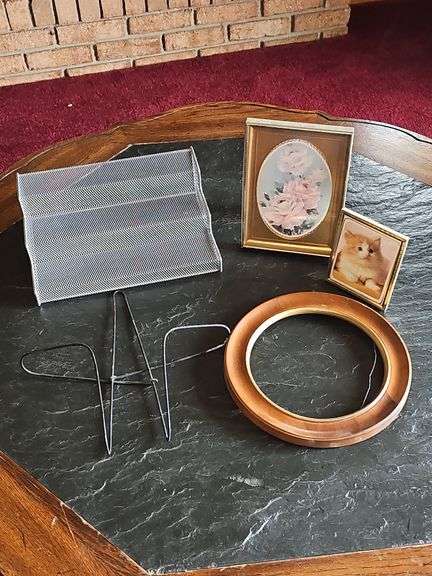 Pictures, round frame, & display rack. - Baker Auctions & Real Estate, LLC