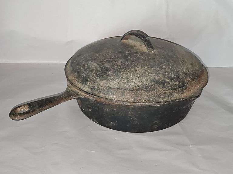 Cast iron chicken pan with a lid - Baker Auctions & Real Estate, LLC