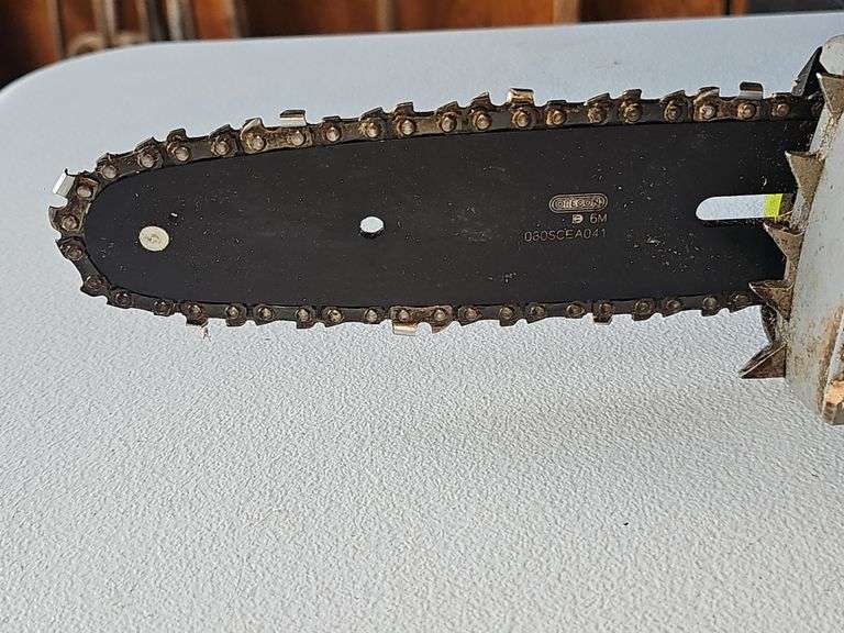 Earthwise battery powered chain saw - Baker Auctions & Real Estate, LLC