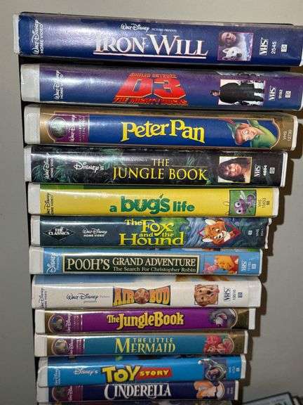 VHS tower, VHS tapes, & few DVDs. - Baker Auctions & Real Estate, LLC
