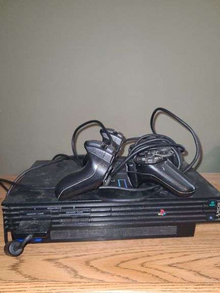 Playstation game system and controllers - Baker Auctions & Real Estate, LLC