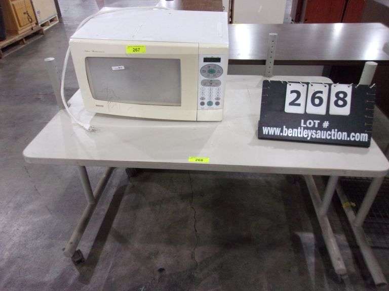 BEIGE CASTERED ANTHRO COMPUTER TABLE - Bentley & Associates, LLC