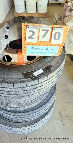 STACK OF WHEELS & TIRES - Bentley & Associates, LLC