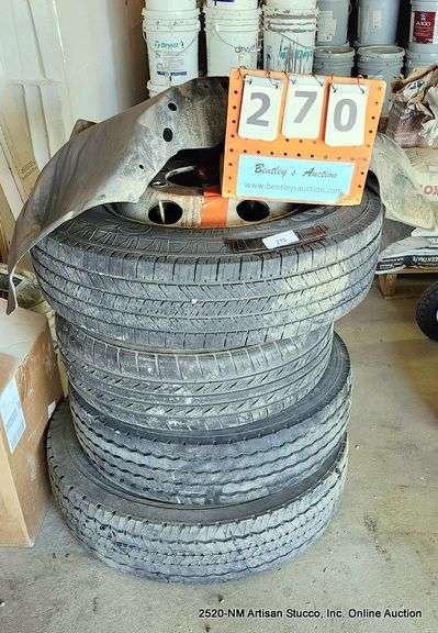 STACK OF WHEELS & TIRES - Bentley & Associates, LLC