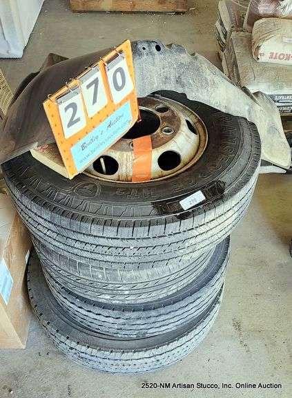 STACK OF WHEELS & TIRES - Bentley & Associates, LLC