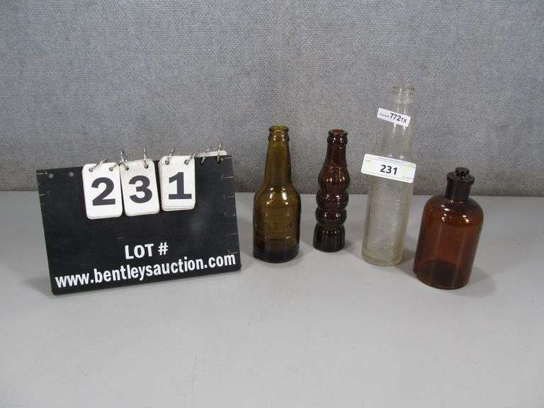 LOT: (4) ASSORTED COLORED & CLEAR BOTTLES - Bentley & Associates, LLC