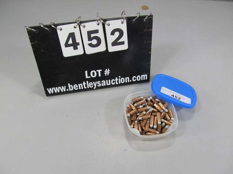 SMALL TUPPERWARE CONTAINER W/ .30 CAL. BULLETS - Bentley & Associates, LLC