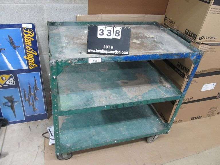 GREEN PAINTED METAL 4-WHEELED SHOT CART - Bentley & Associates, LLC