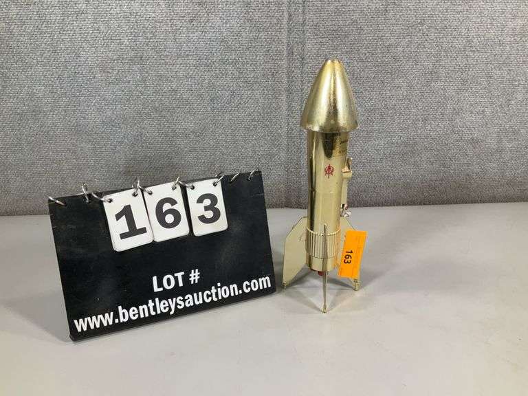 GOLD COLOR METAL ROCKET BANK W/ KEY - AMARILLO - Bentley & Associates, LLC