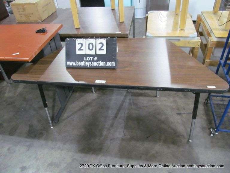 TRAPEZOID SHAPED DESK - Bentley & Associates, LLC
