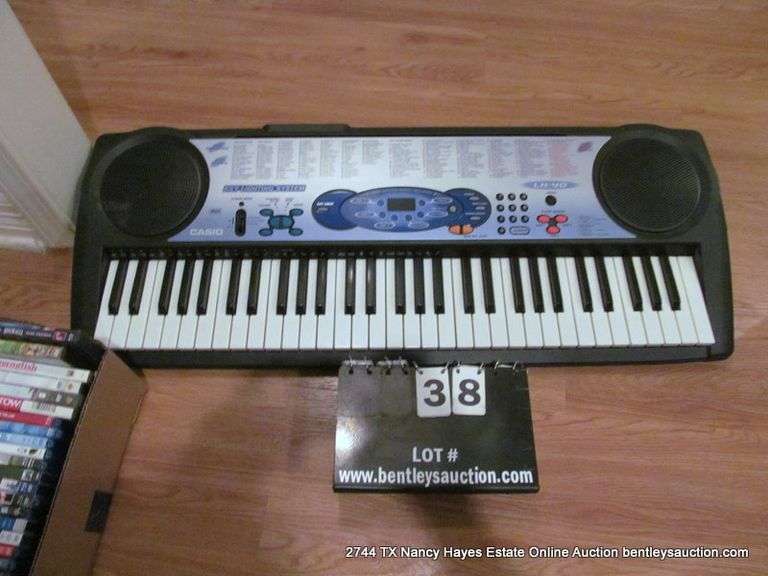 CASIO ELECTRIC KEYBOARD MODEL LK-40 - Bentley & Associates, LLC