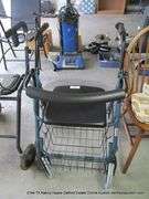 GUARDIAN LIGHT BLUE FOLDING CASTERED WALKER - Bentley & Associates, LLC