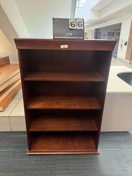 BROWN WOODEN BOOKSHELF W/ 4 SHELVES - Bentley & Associates, LLC