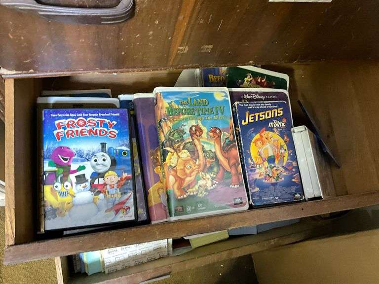 CONTENTS OF DRAWER: VARIOUS VHS & CD MOVIES - Bentley & Associates, LLC
