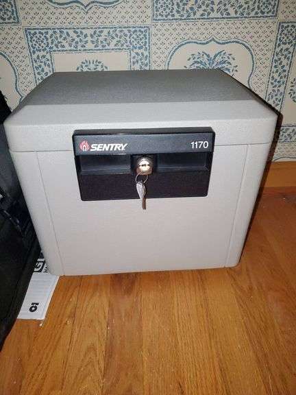 Sentry safe 1170 with key ...located in main foyer hall closet - Bid ...