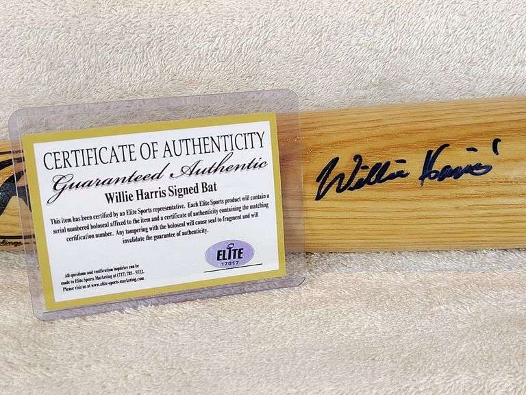 Willie Harris autographed baseball bat. Blue sharpie on the barrel ...