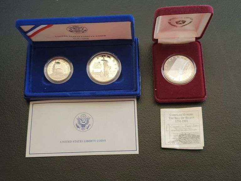 1986 United States Liberty coins in original packaging, 1991 Chrysler ...
