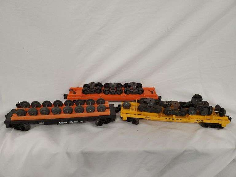 Lionel flat cars with wheel loads includes #16369 Amtrak, #16715 AT&SF ...
