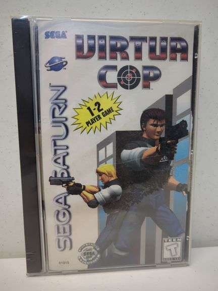 Sega Saturn Virtua cop stored in re-shrink to protect. Removed to show ...