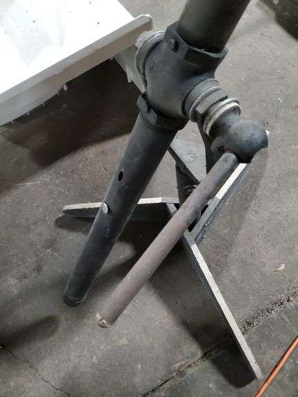 Adjustable metal stand. Top bar measures 57 in wide. - Bid-Assets ...