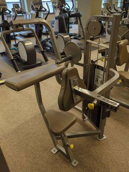 Cybex arm extension machine. 4825-99. Located on second floor. Bring ...
