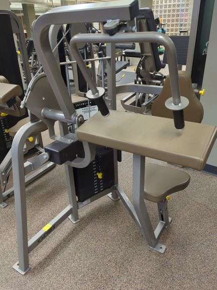 Cybex arm extension machine. 4825-99. Located on second floor. Bring ...