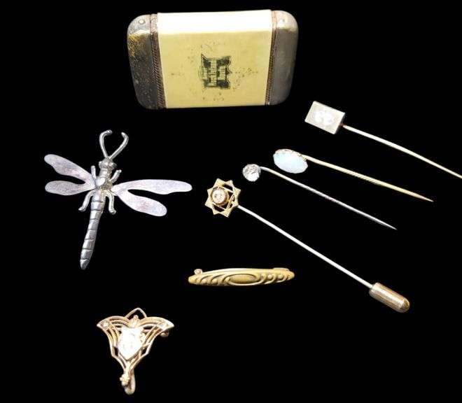 Gold tone hat pins (two with white glass stone .. one opal colored ...