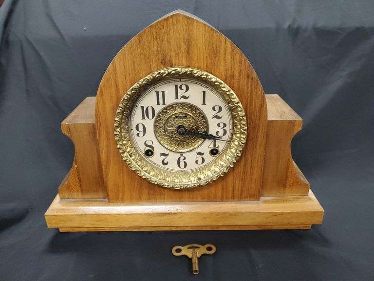 Antique solid wood mantle clock with brass accent. Includes key. Unable ...