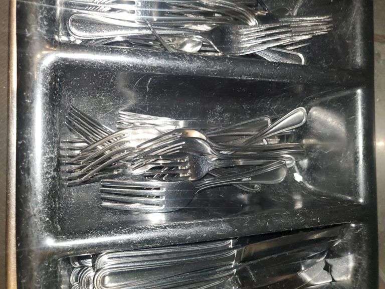 Winco stainless flatware which includes 48 forks, 50 dinner knives ...