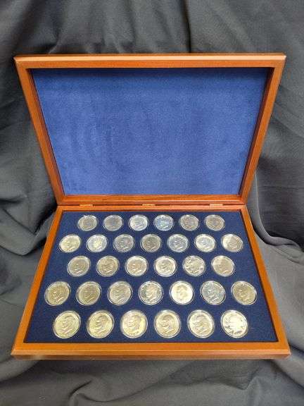 The complete Eisenhower Silver Dollar (32) coin collection. Includes BU ...