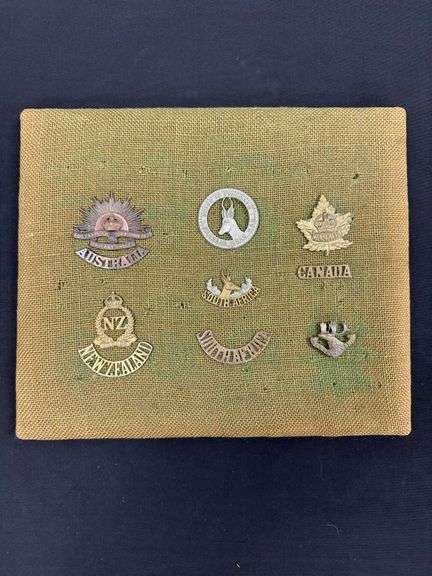 A Vintage Collection of WWI and WWII Pins / Badges - Bartlett Auctions Inc.