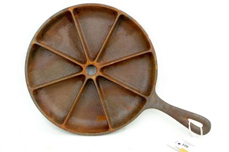 Lodge cast iron cornbread skillet, 9" diameter. Shows some rust ...