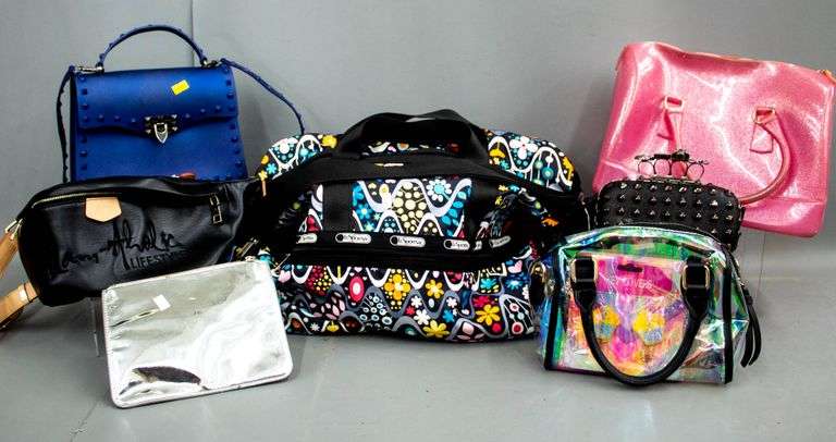 Mia Ray Fanny Pack, a blue and a pink rubber purse with a see through ...