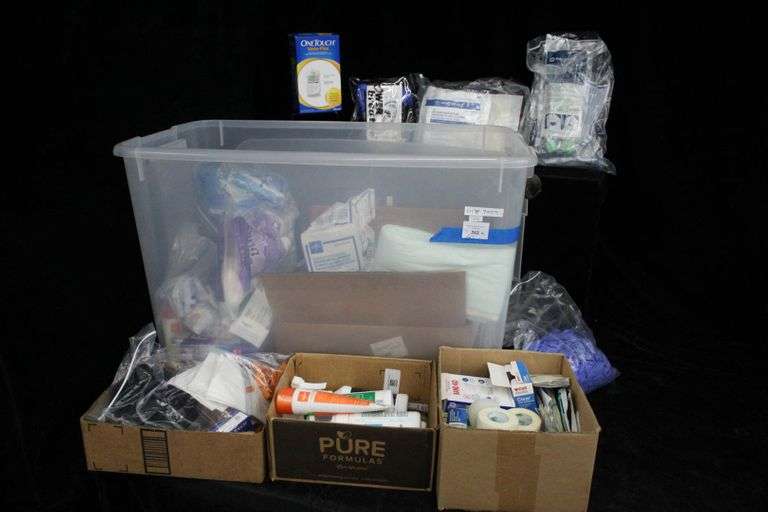 Collection of medical supplies in large Sterilite bin. Items include ...