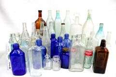 Vintage glass bottle collection, includes Moroline petroleum jelly jar ...