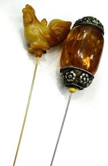 Amber and Carved Carnelian Hat Pins. Unmarked - silver one is magnetic ...