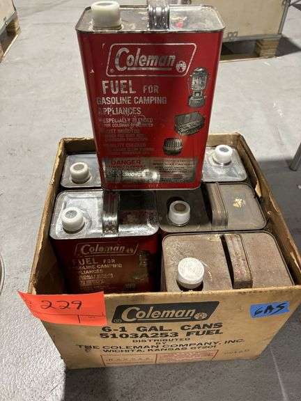 6 gallons of Coleman gasoline fuel full - Bonnigson & Associates