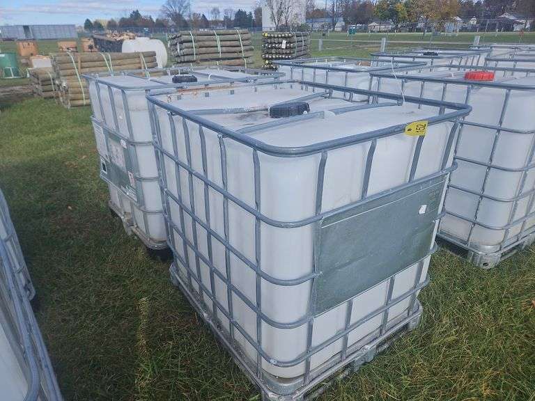 152 - (2) PLASTIC TOTES W/VALVE & METAL FRAME - Bonnigson & Associates