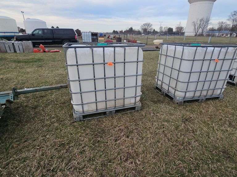 6651 - 250 GALLON POLY TANKS WITH CAGE - Bonnigson & Associates