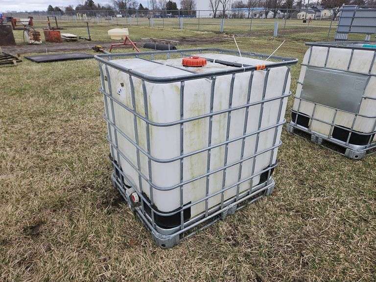 6649 - 250 GALLON POLY TANKS WITH CAGE - Bonnigson & Associates