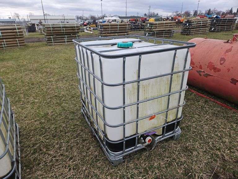 6644 - 250 GALLON POLY TANKS WITH CAGE - Bonnigson & Associates