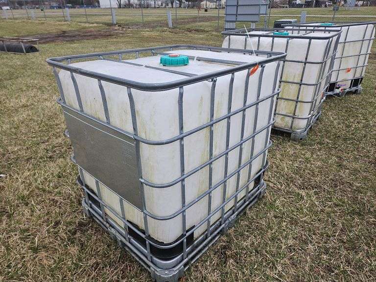 6648 - 250 GALLON POLY TANKS WITH CAGE - Bonnigson & Associates