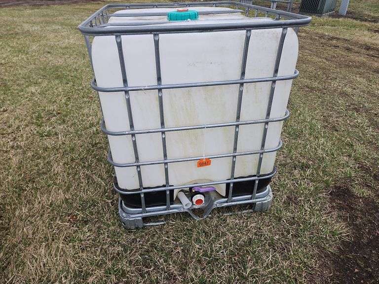 6647 - 250 GALLON POLY TANKS WITH CAGE - Bonnigson & Associates
