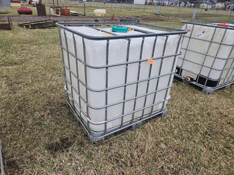 6650 - 250 GALLON POLY TANKS WITH CAGE - Bonnigson & Associates